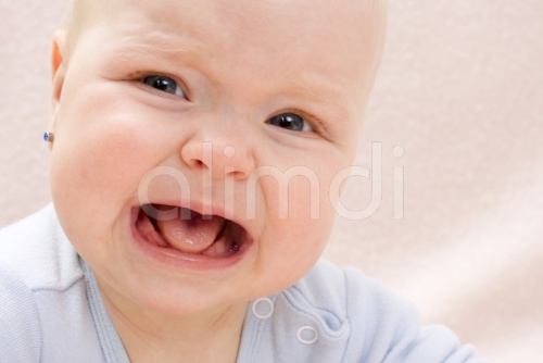 Weeping baby, 7 months stock image - alimdi