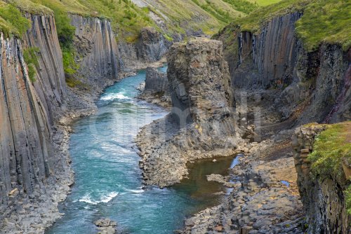 Jkla glacial river and basalt columns, volcanic rock formations at ...